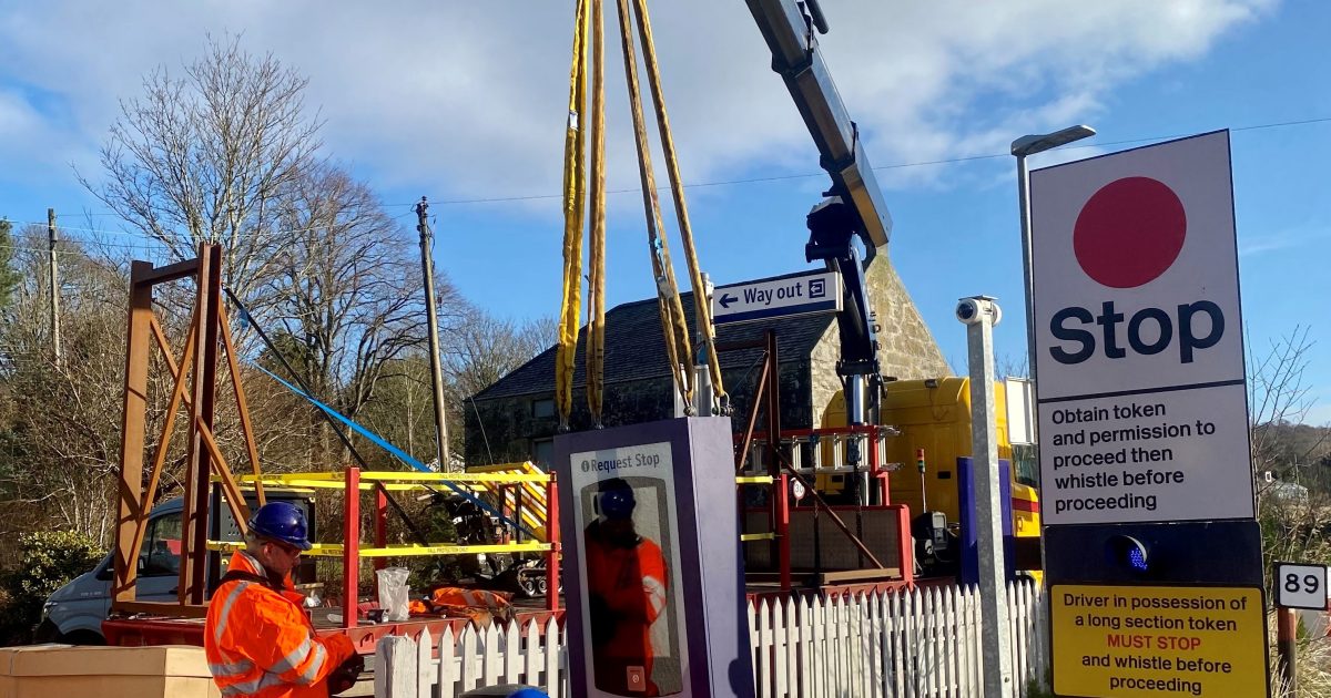 Passenger hand signalling at end of line as Telent installs new req...